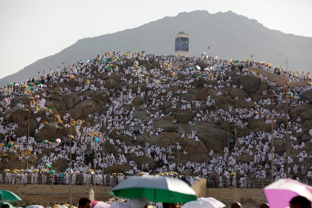 Muslim pilgrims gather on Mount Mercy on the plains of Arafat during ... Muslim pilgrims gather on Mount Mercy on the plains of Arafat during ...